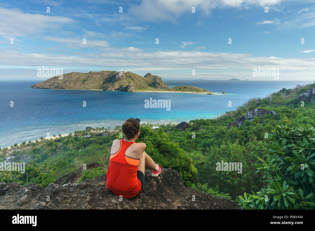 At the halfpoint of a hike to the main peak of Wayalailai island ...