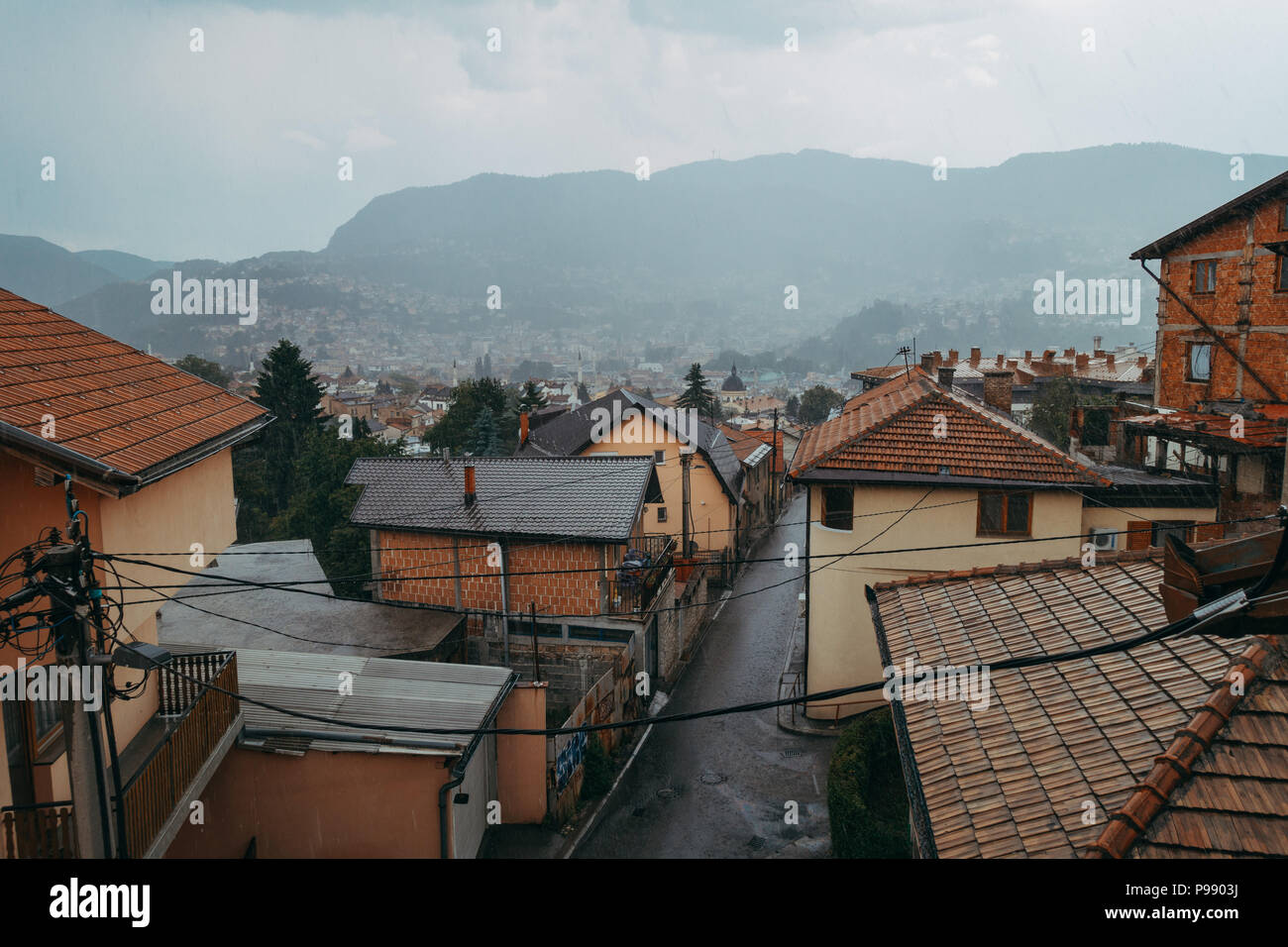 Looking out through the narrow streets of a hillside suburb in Sarajevo ...