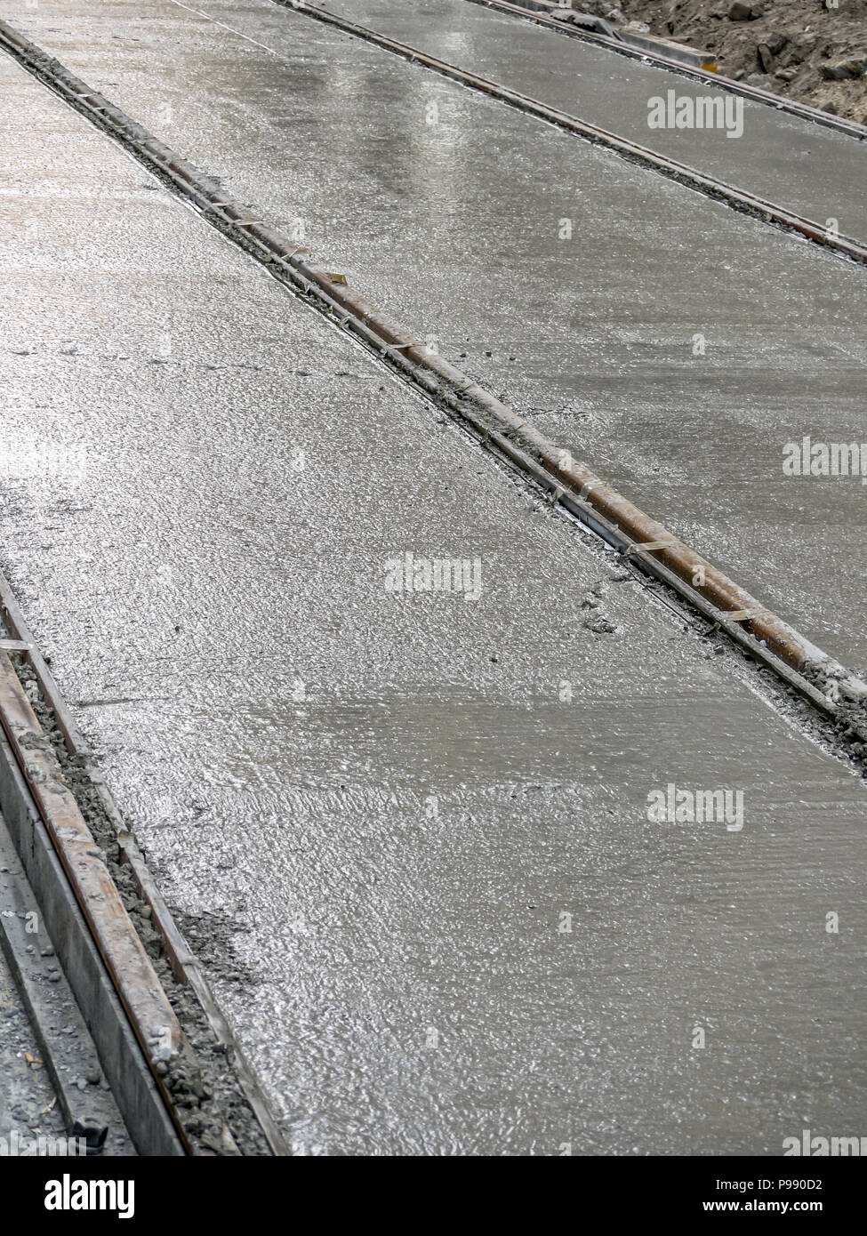 Fresh concrete slab poured for new tramway track Stock Photo - Alamy