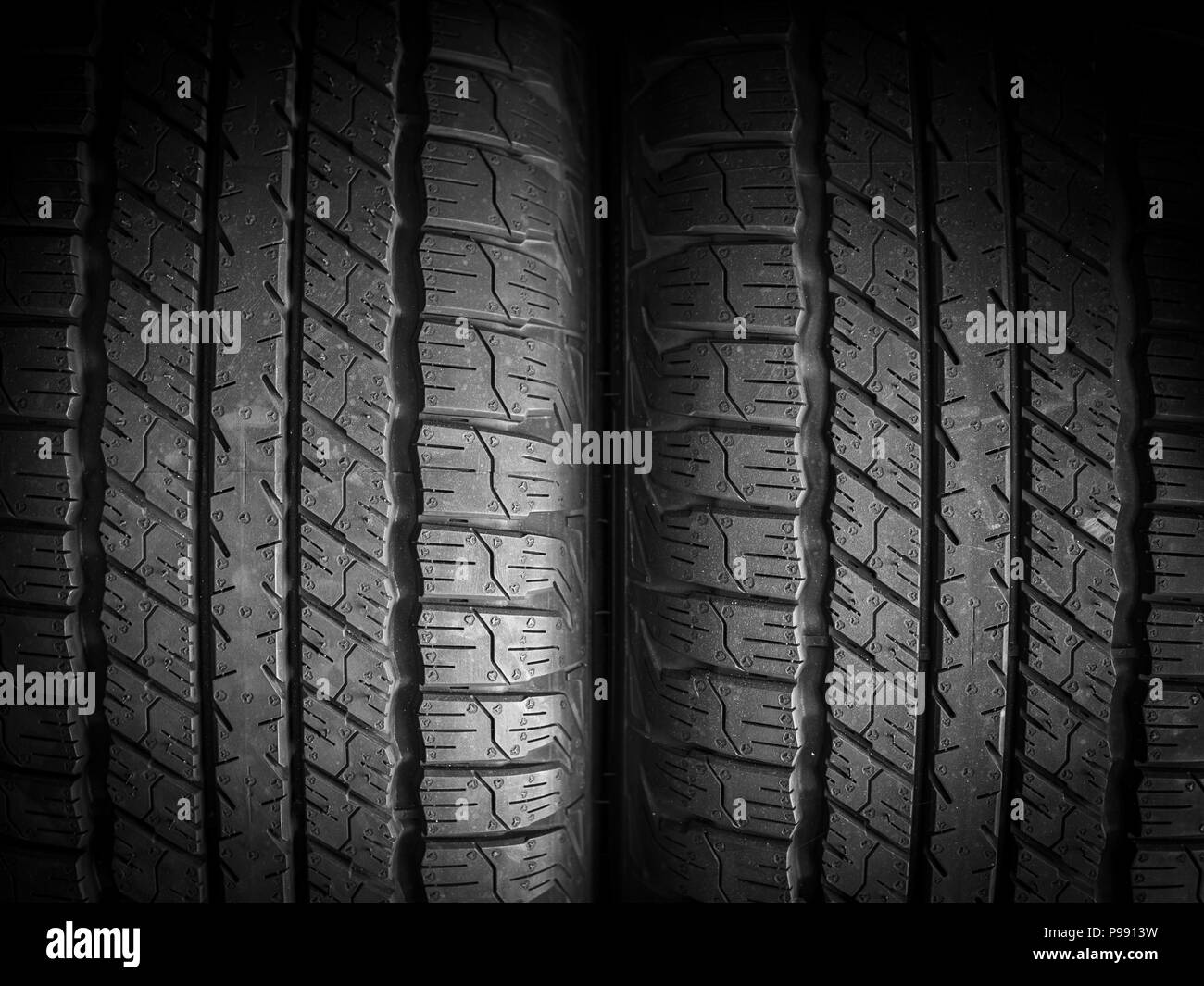 Car tires texture in the dark background Stock Photo - Alamy