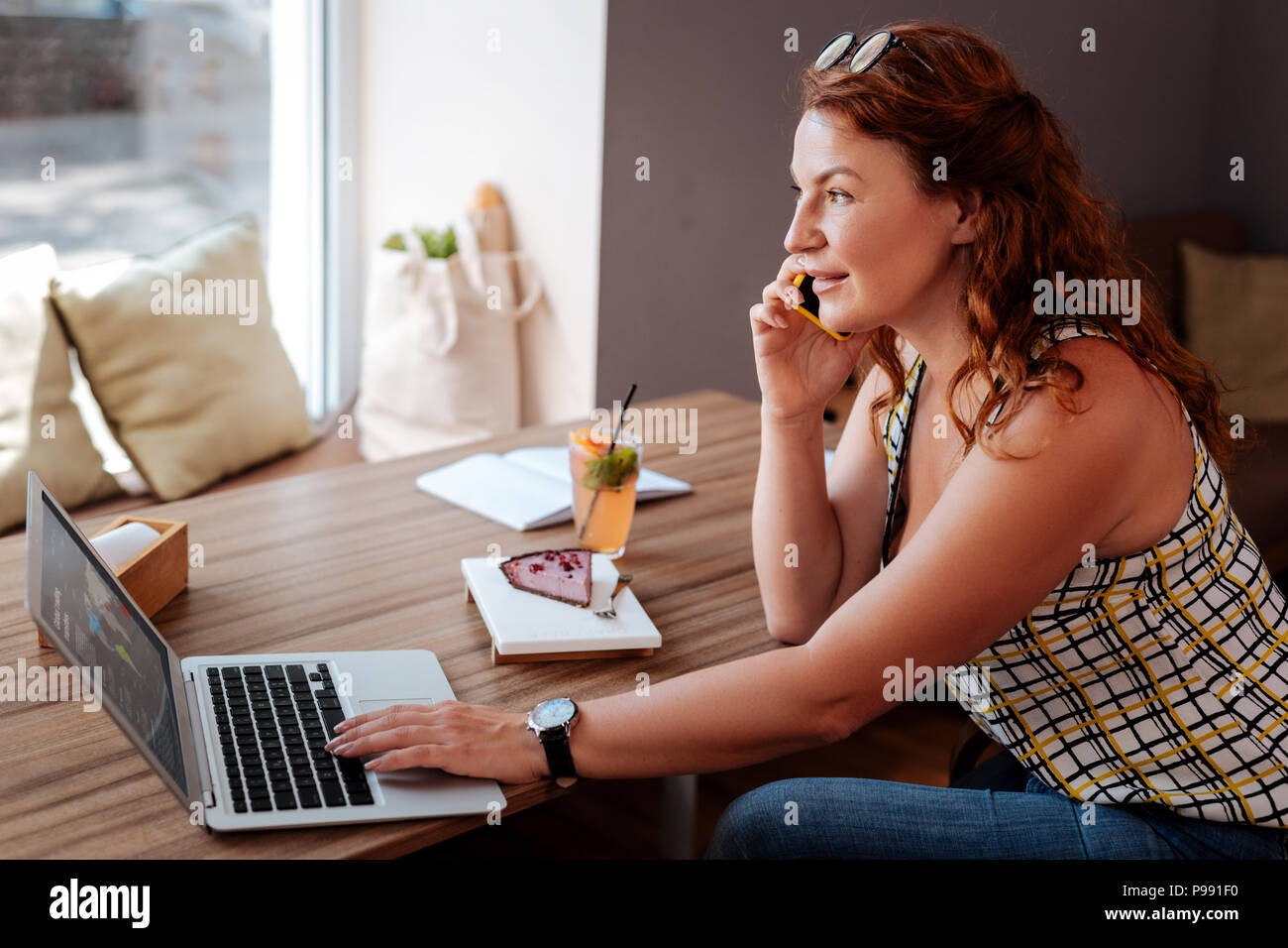Busy businesswoman calling her business partner Stock Photo - Alamy
