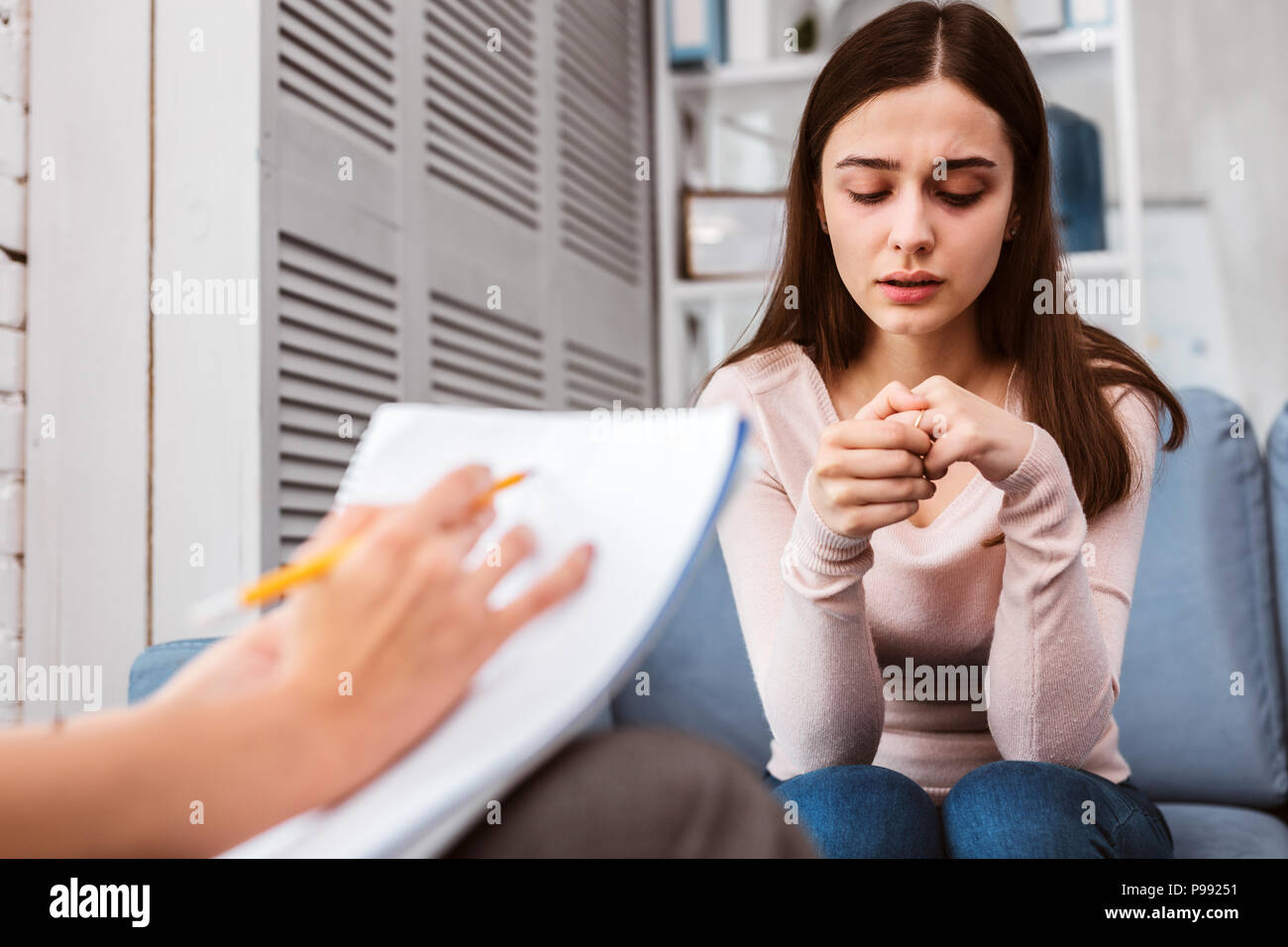 Doctor room sad woman hi-res stock photography and images - Alamy