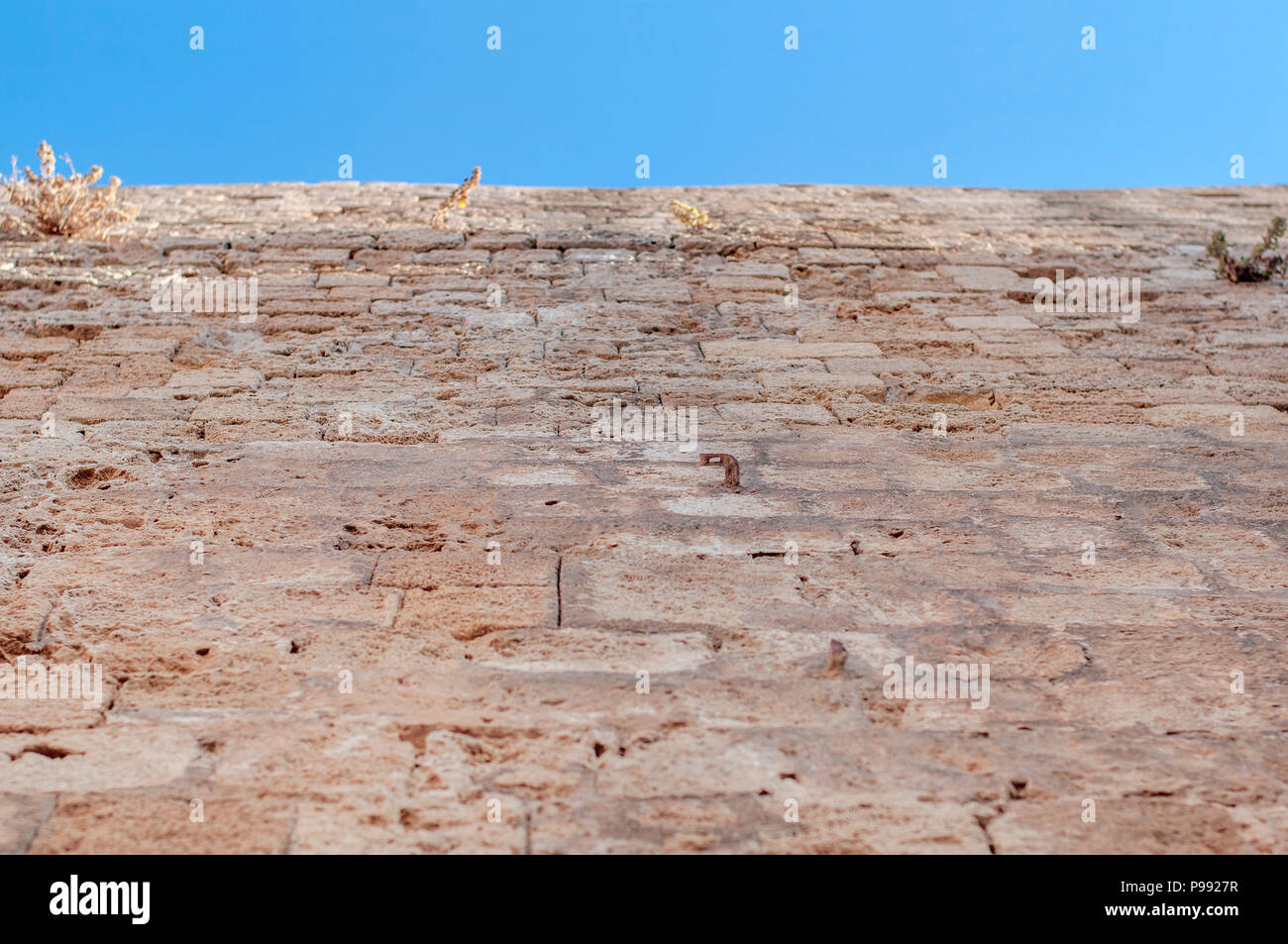 Castle wall block pattern of old construction rock with clean sky Stock ...