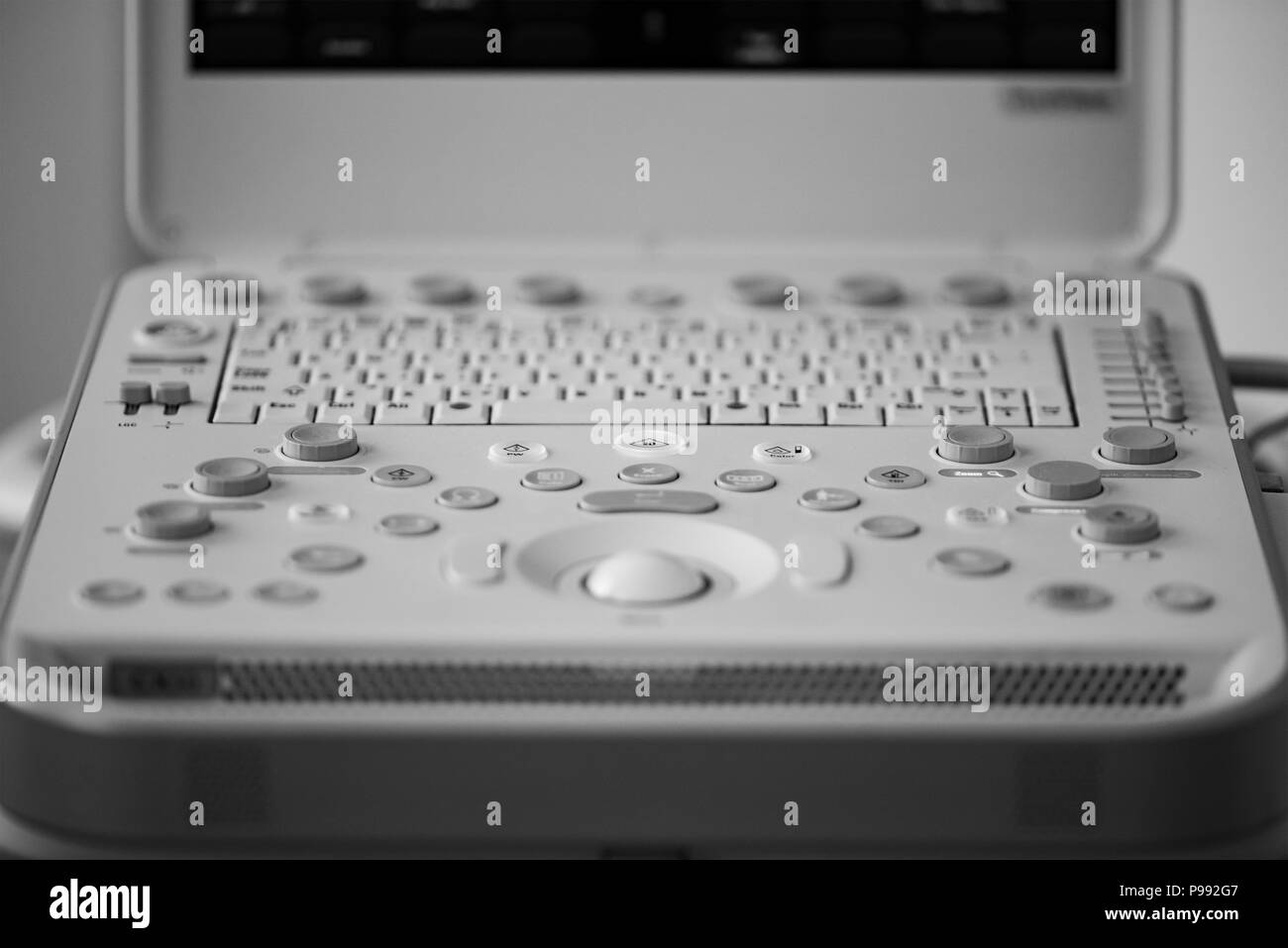 Keyboard with gray and orange buttons on the control panel of a modern ...