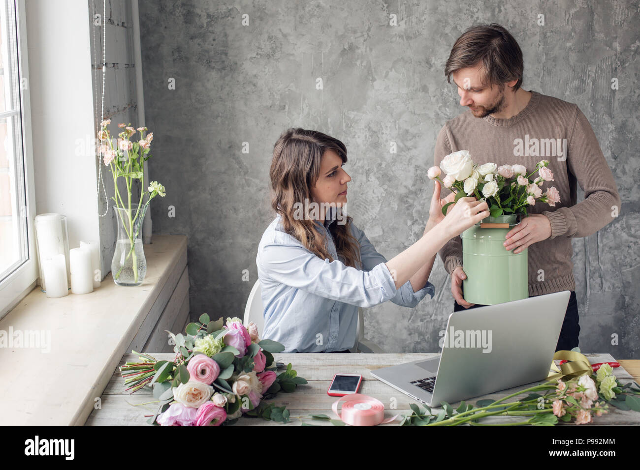 The concept of working in a flower shop. Order-taking and delivery ...
