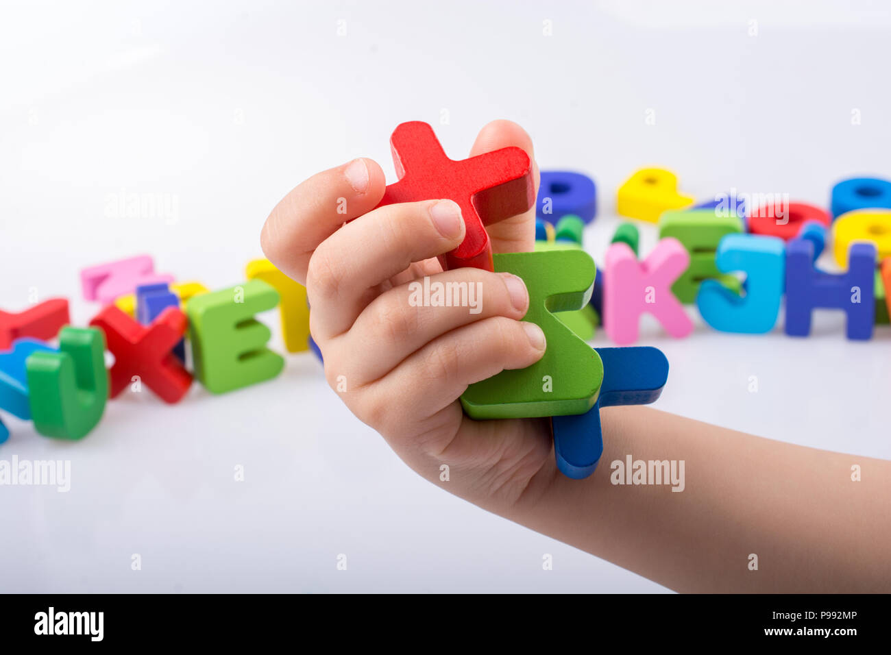 Letter cube of plus sign made of wood Stock Photo - Alamy