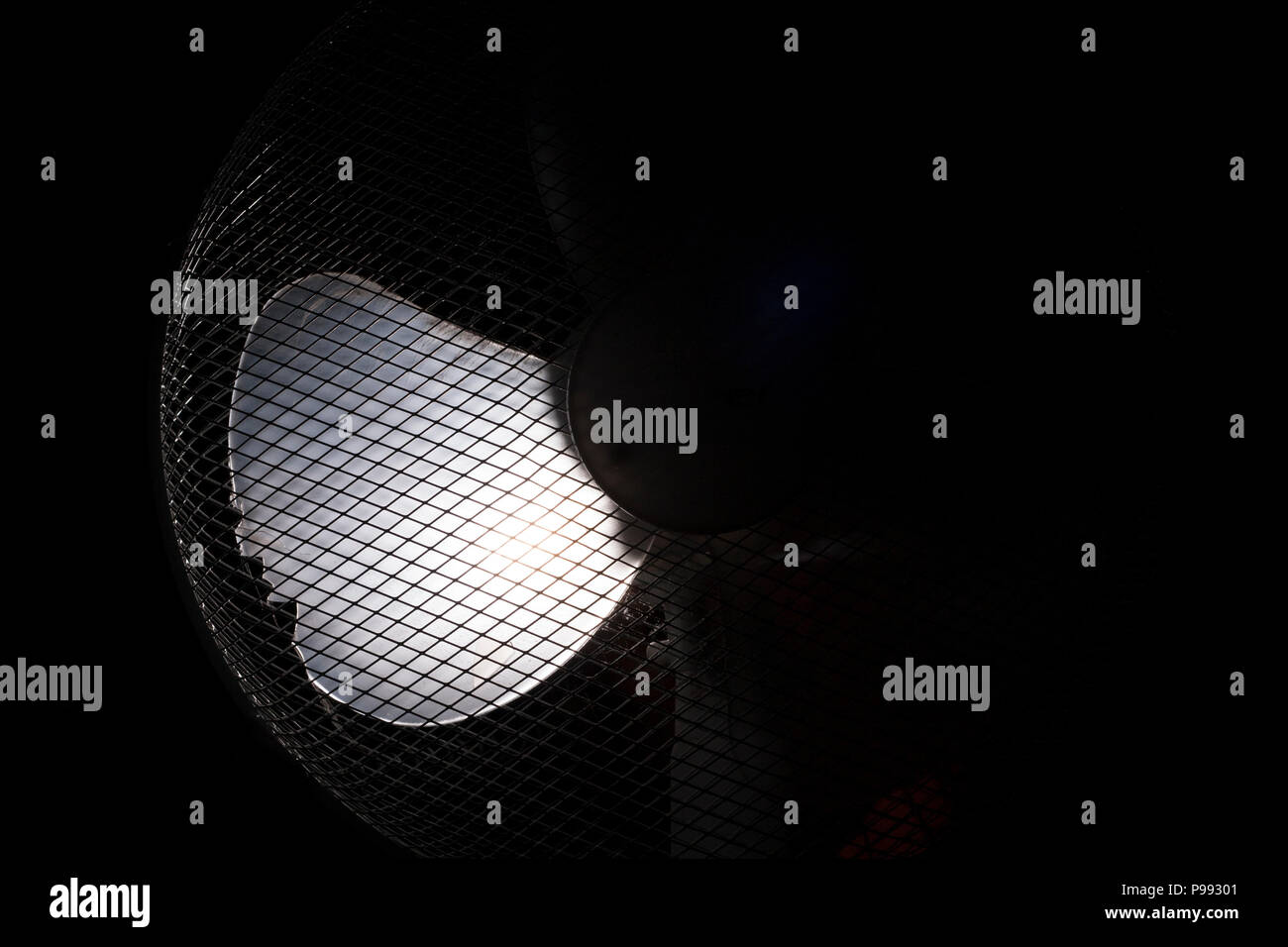 Damaged blade of air fan on black background Stock Photo - Alamy