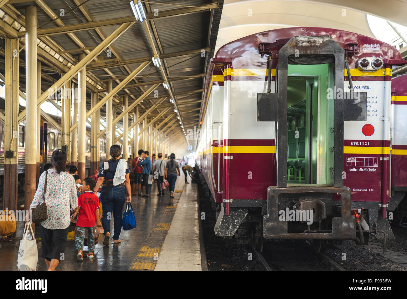 people were waiting for a Thai Red Sprinter train, Diesel locomotive ...