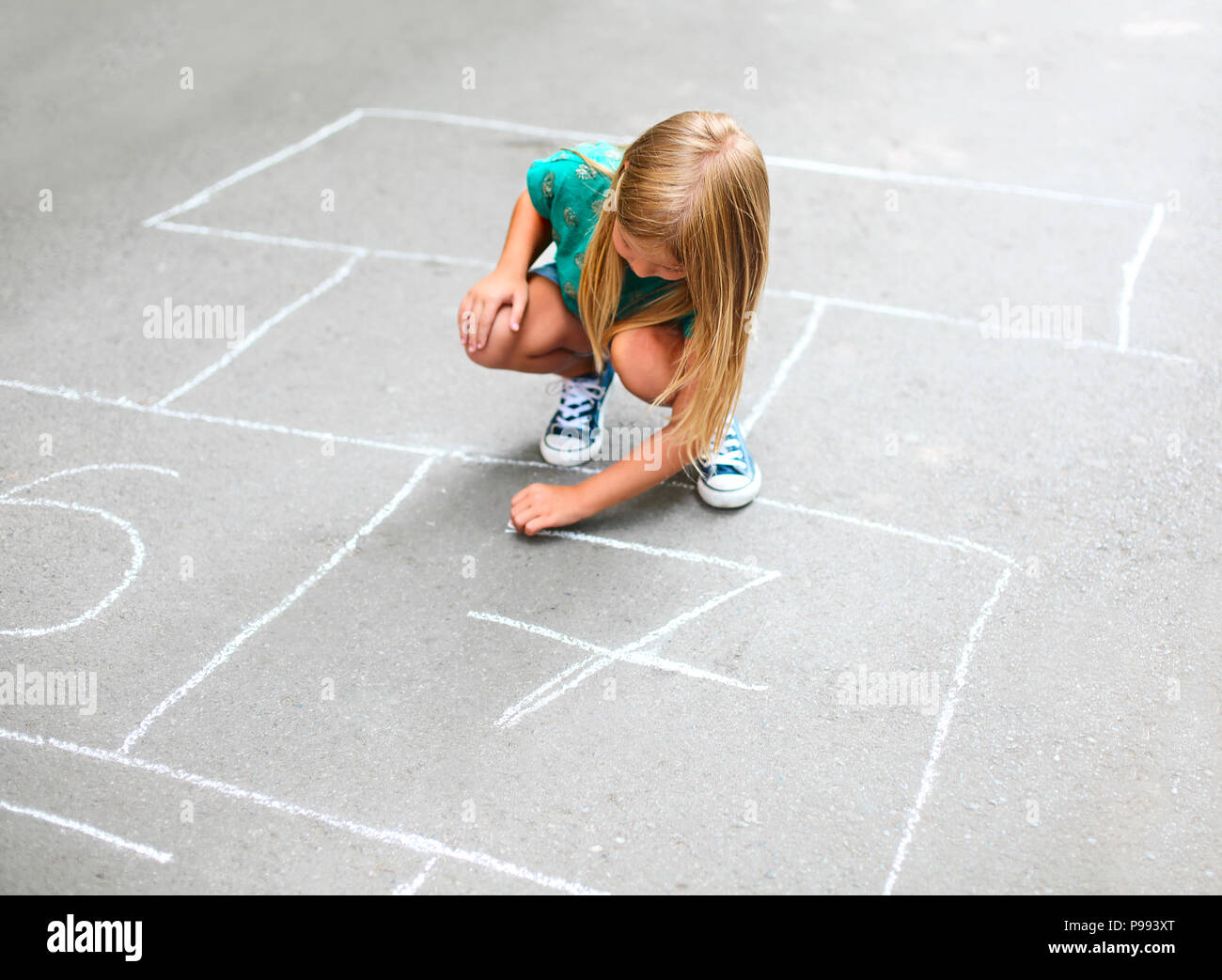 Kid playing hopscotch on playground outdoors, children outdoor ...