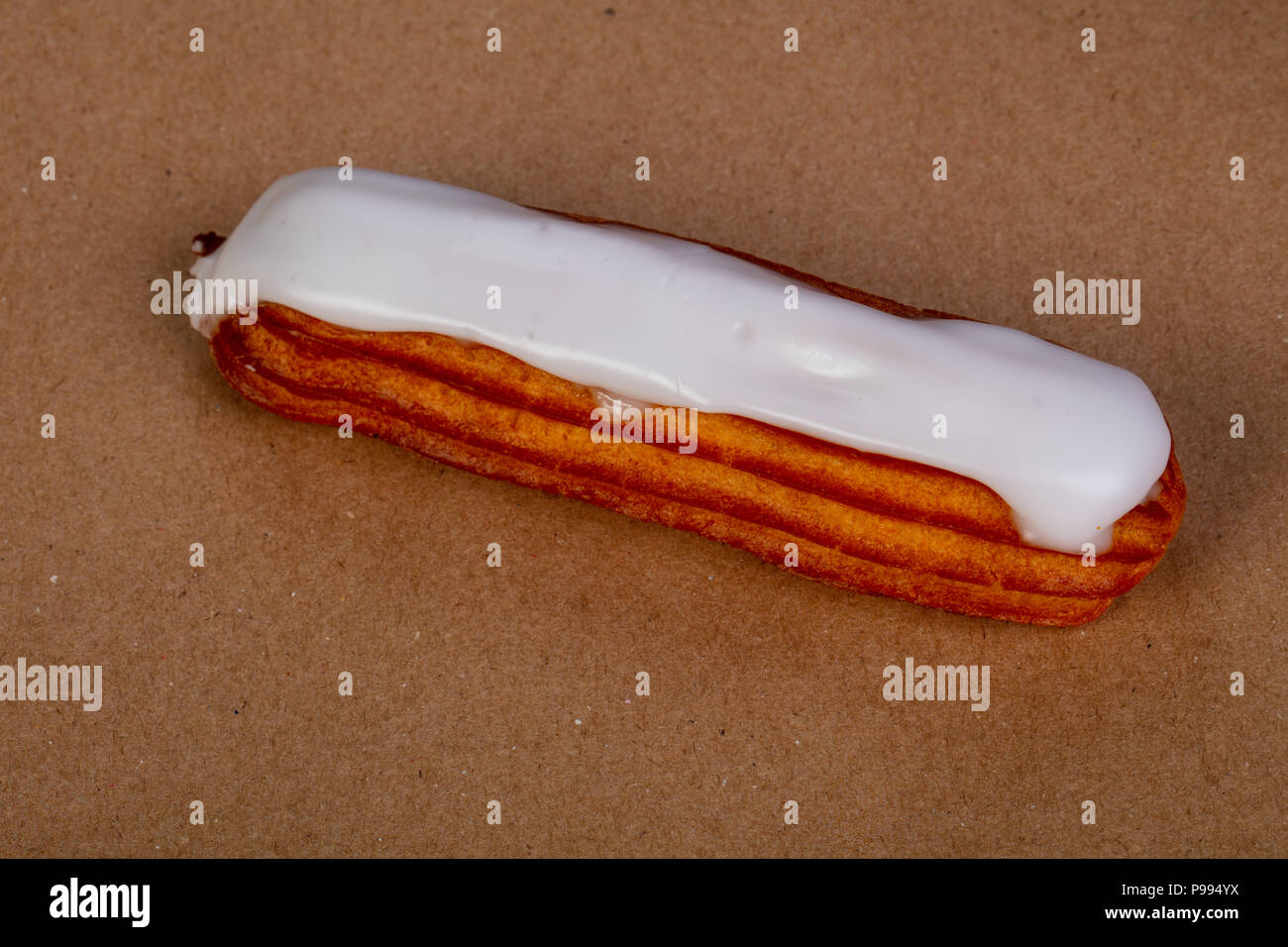 Eclair with cream and icing Stock Photo - Alamy