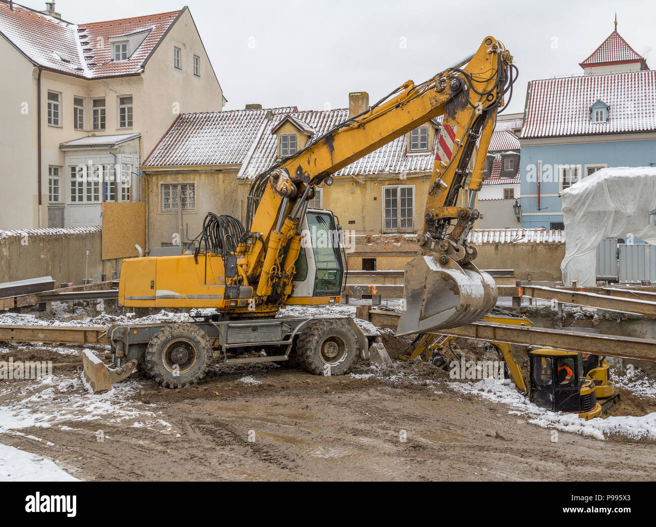 digger on a building lot in urban ambiance seen in Prague at winter ...