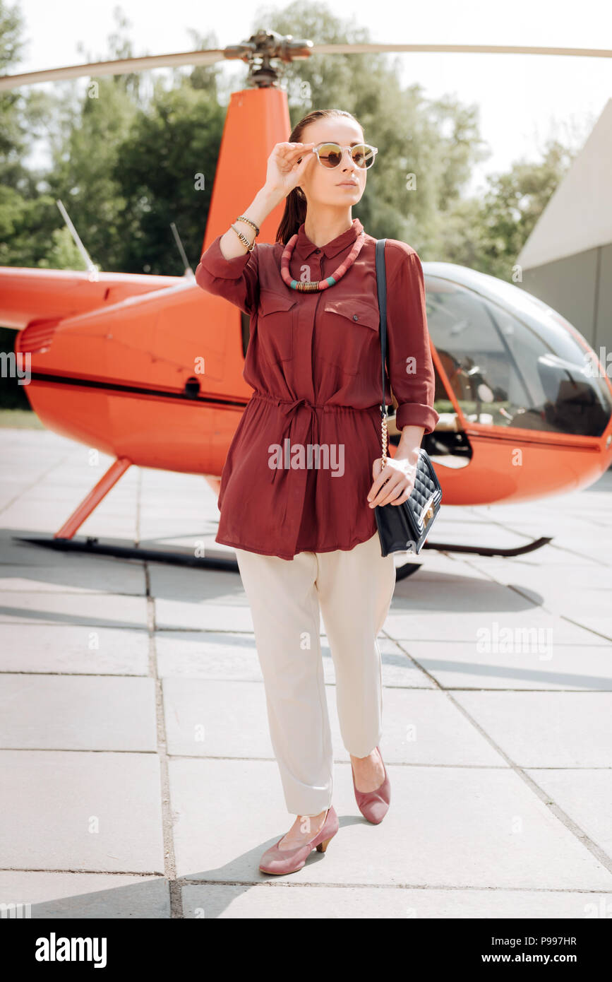 Beautiful pretty woman trying helicopter flight Stock Photo - Alamy