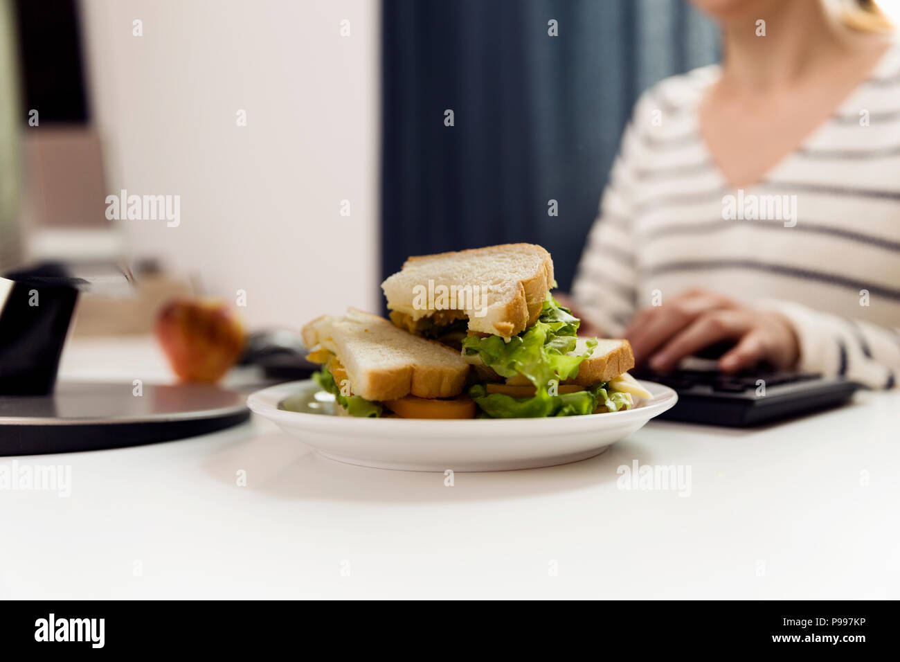 Woman sandwich desk hi-res stock photography and images - Alamy