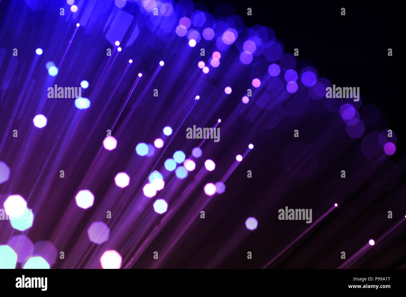 purple fiber optic abstract background on black Stock Photo - Alamy
