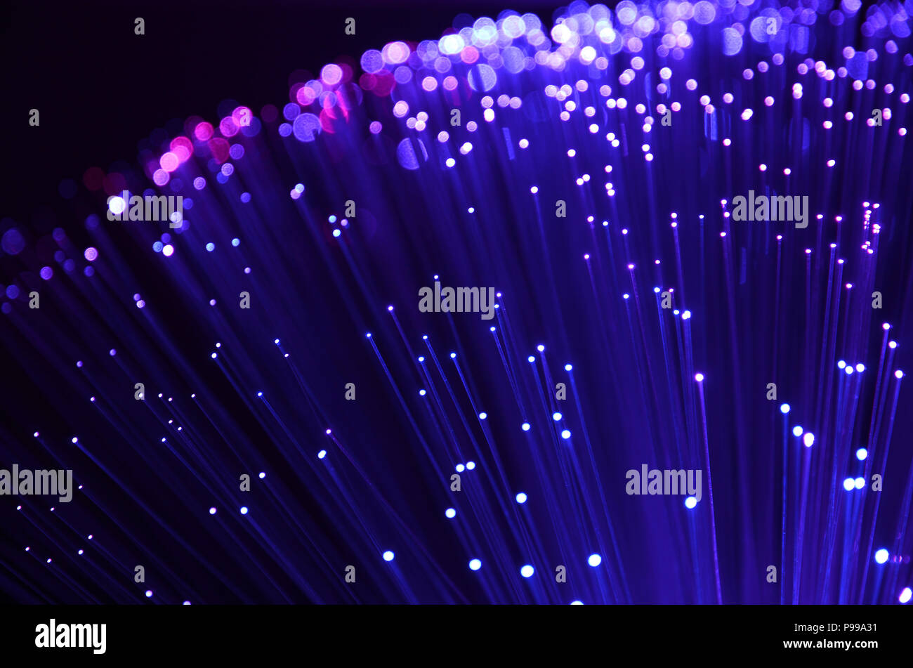 purple fiber optic abstract background on black Stock Photo - Alamy