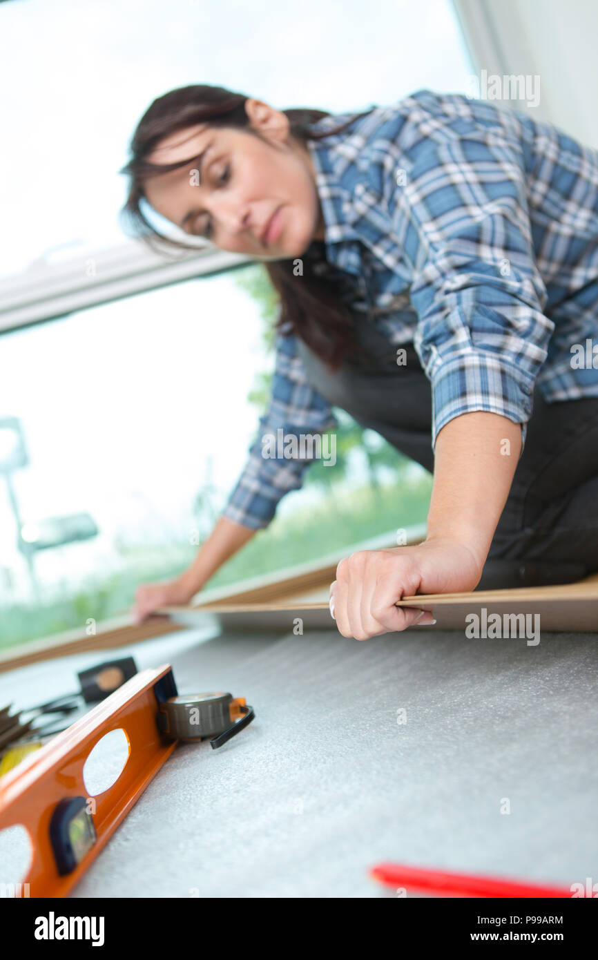 female labor fitting wooden floor Stock Photo - Alamy
