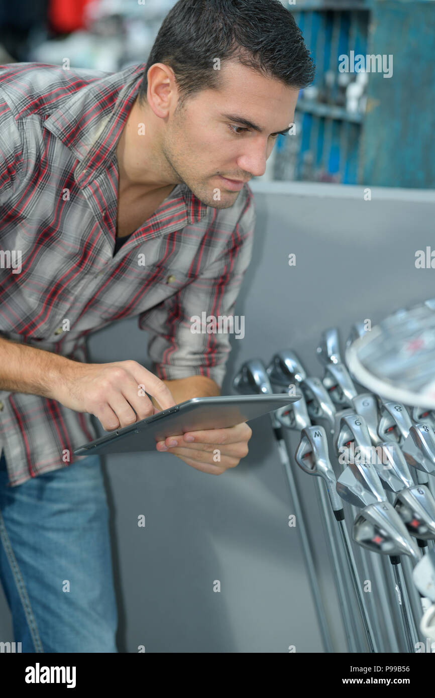 Woman comparing prices in hi-res stock photography and images - Alamy