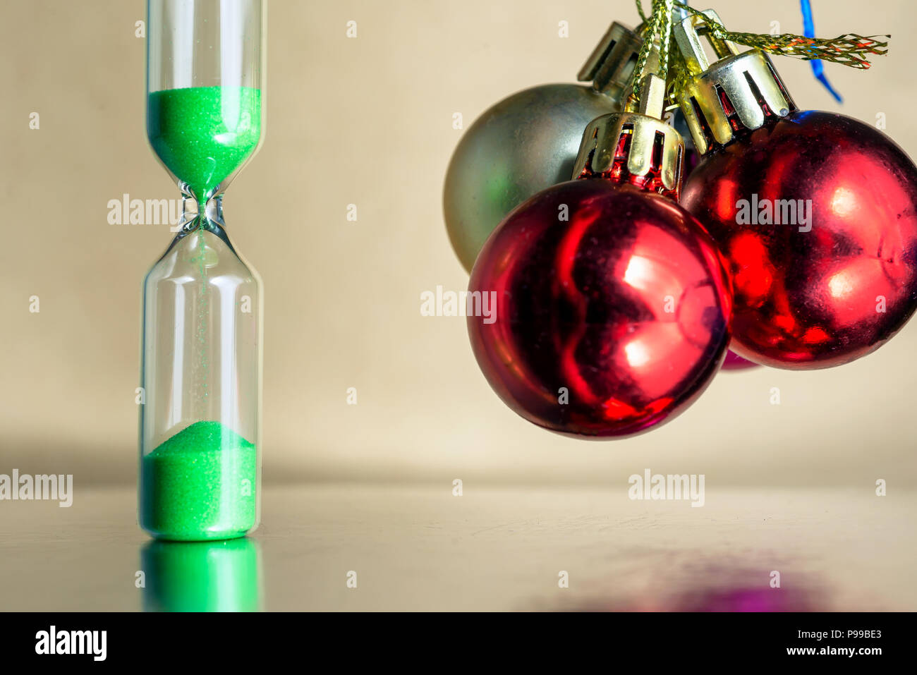 Modern beautiful green hourglass with bright background for copy space ...
