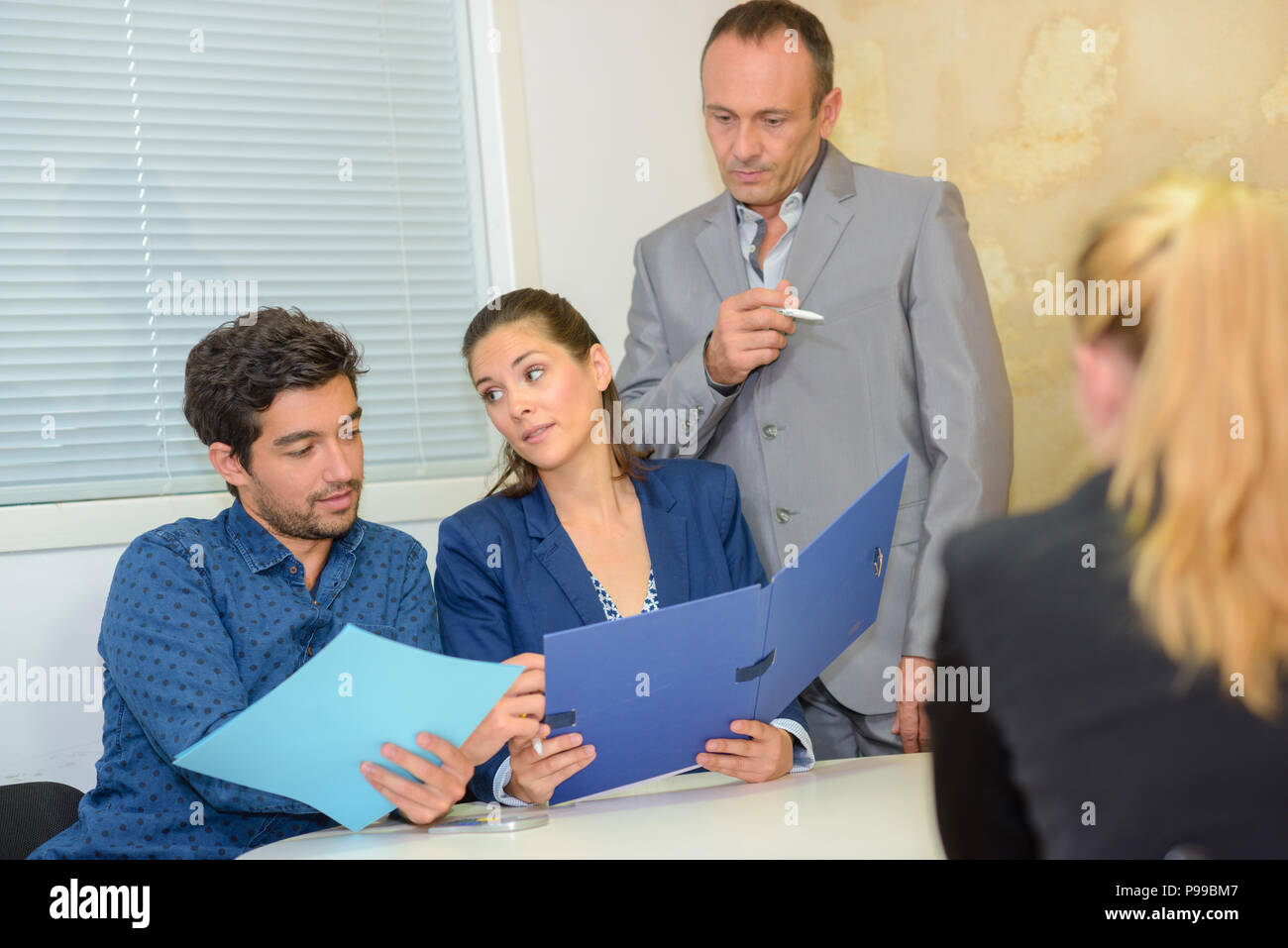 group of business people addressing office meeting Stock Photo - Alamy