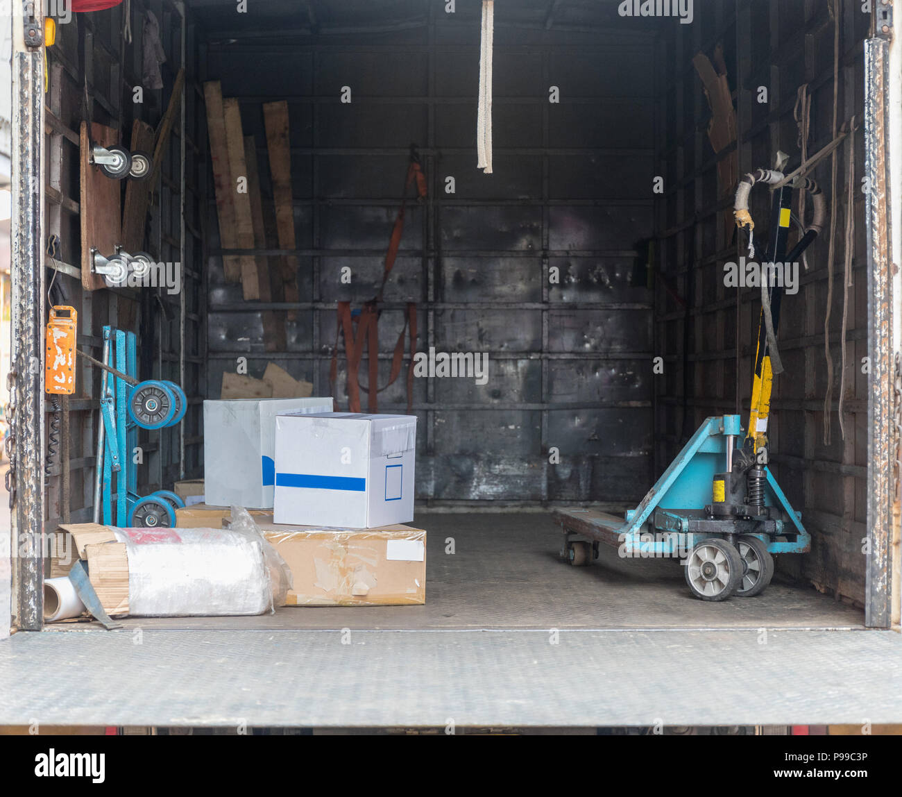 Boxes and Pallet Jack in Delivery Truck Stock Photo - Alamy