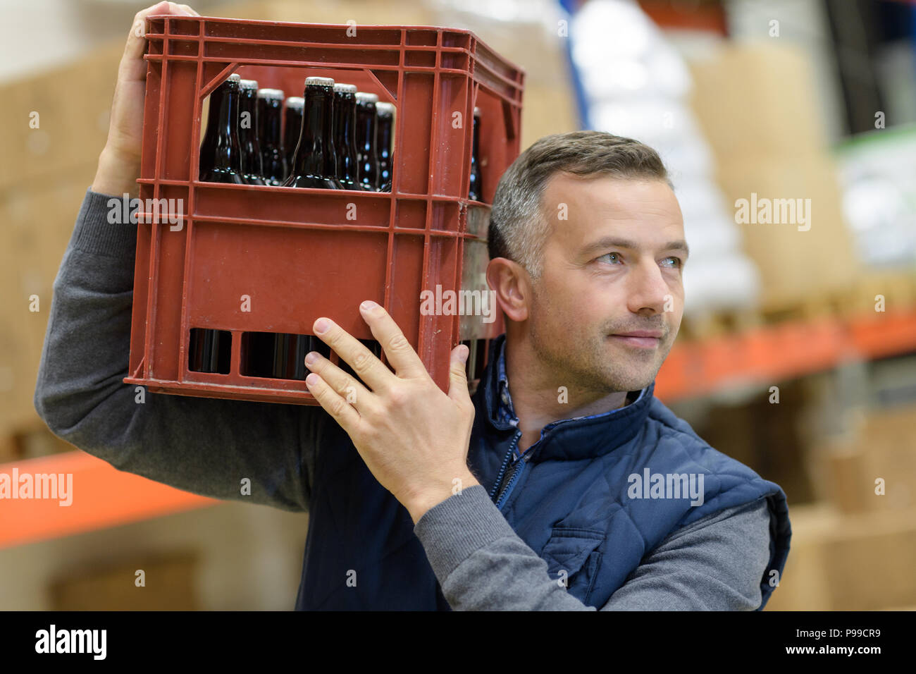 Man carrying plastic box hi-res stock photography and images - Alamy