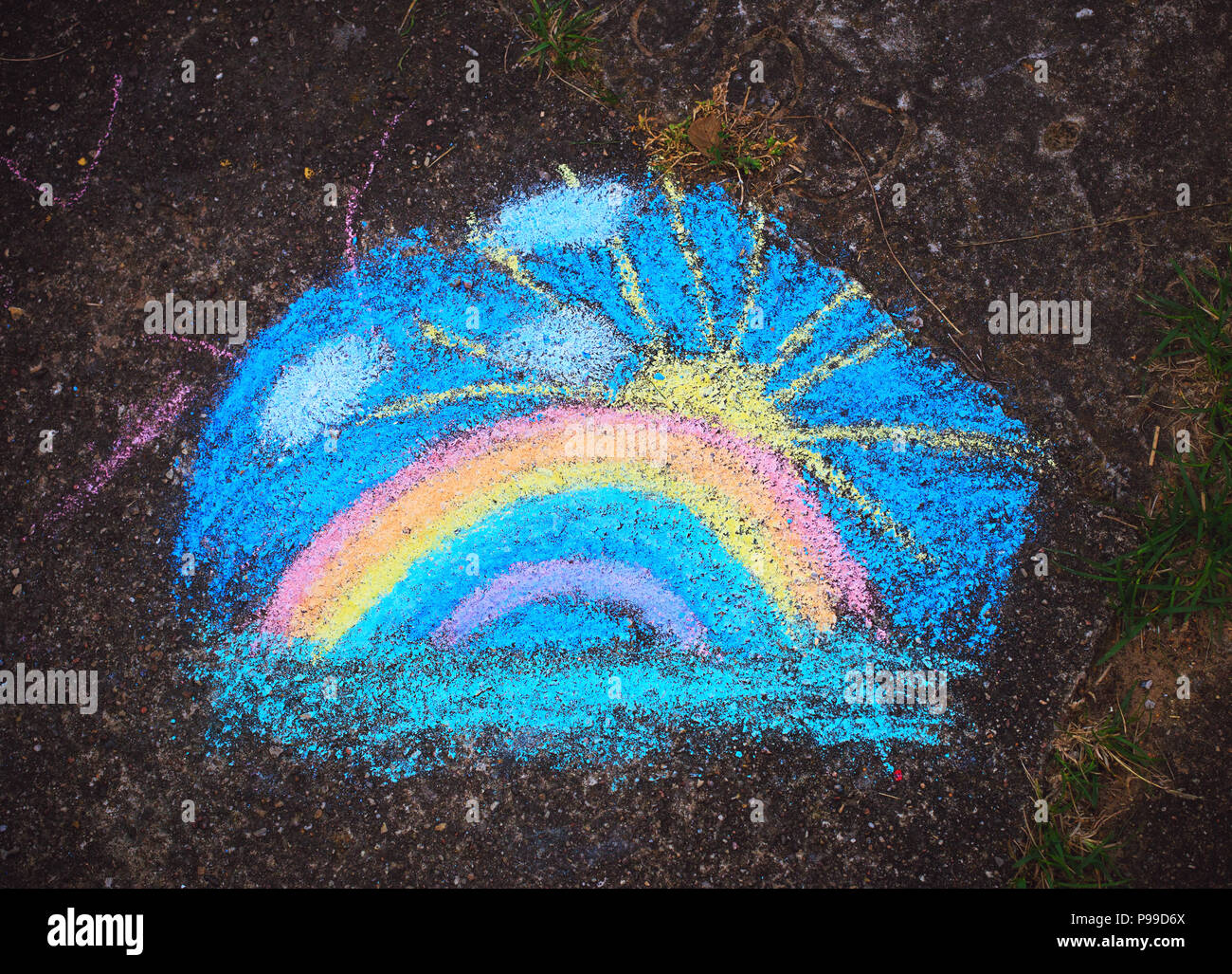 Children drawing on a pavement with chalk hi-res stock photography and ...