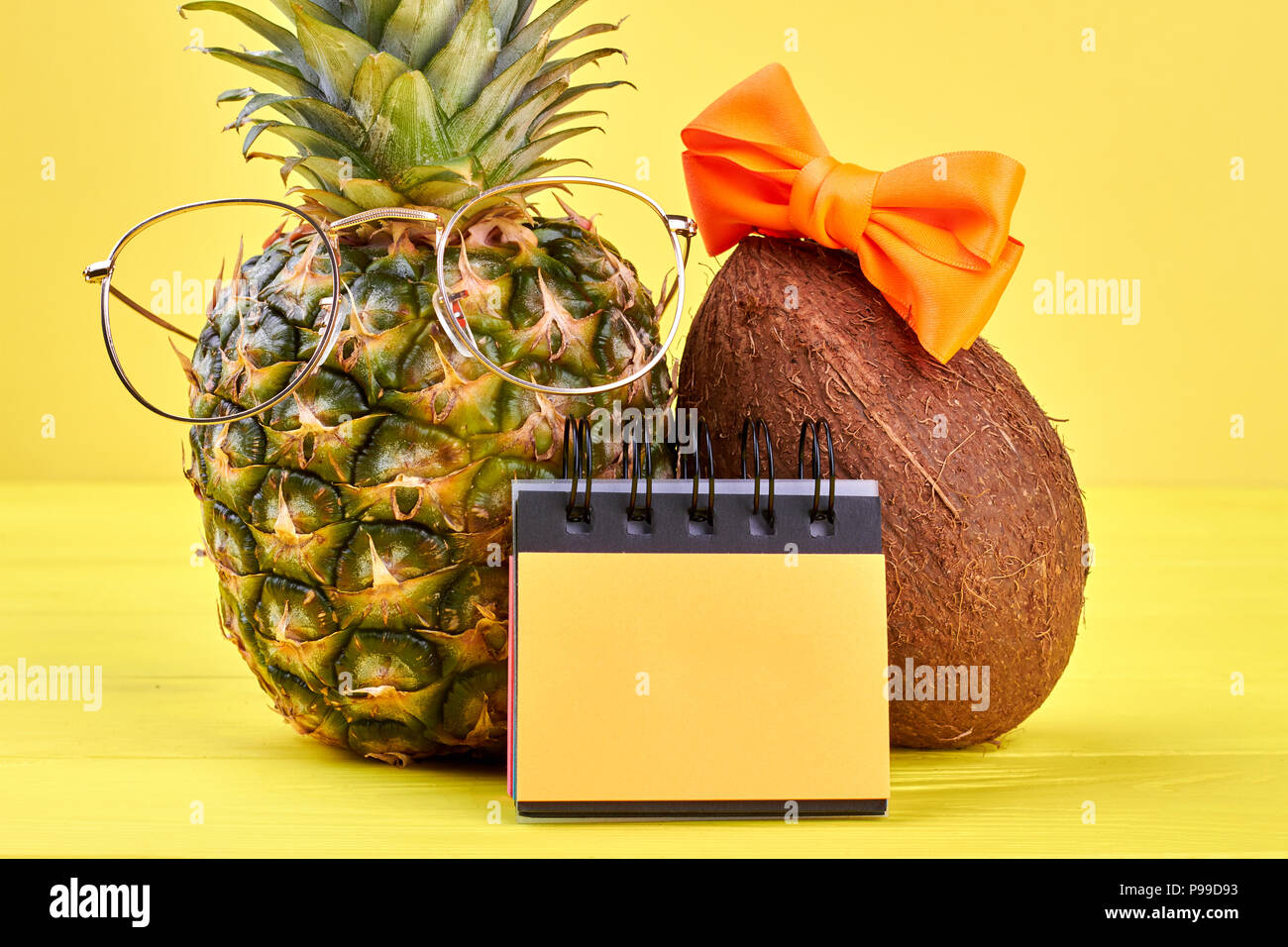 Pineapple, coconut and binder notebook. Tropical vacation concept. Time ...