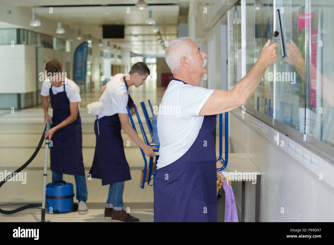 janitors cleaning on the hallway Stock Photo - Alamy