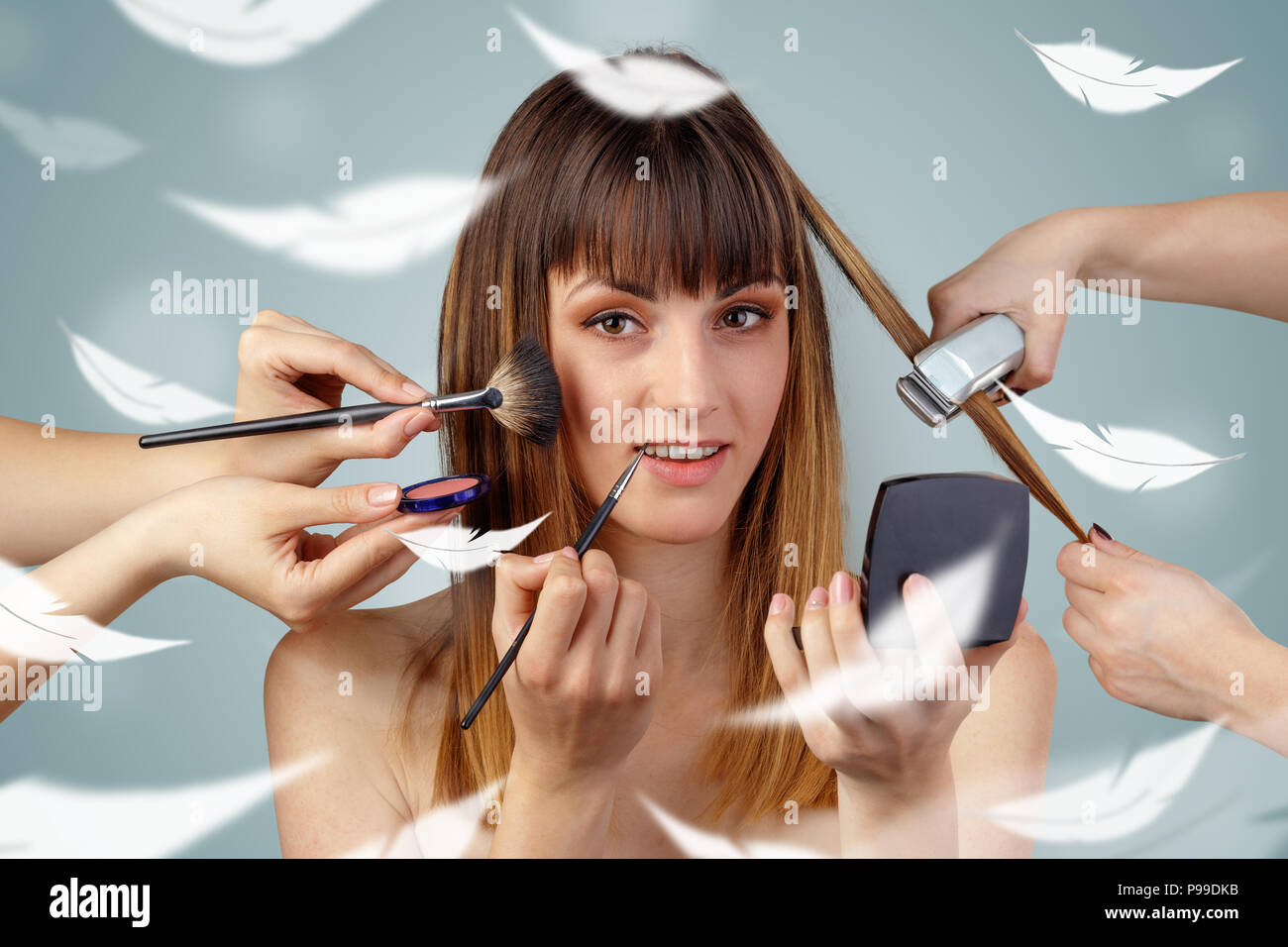 Pretty brunette woman at salon with plume around and ethereal concept ...