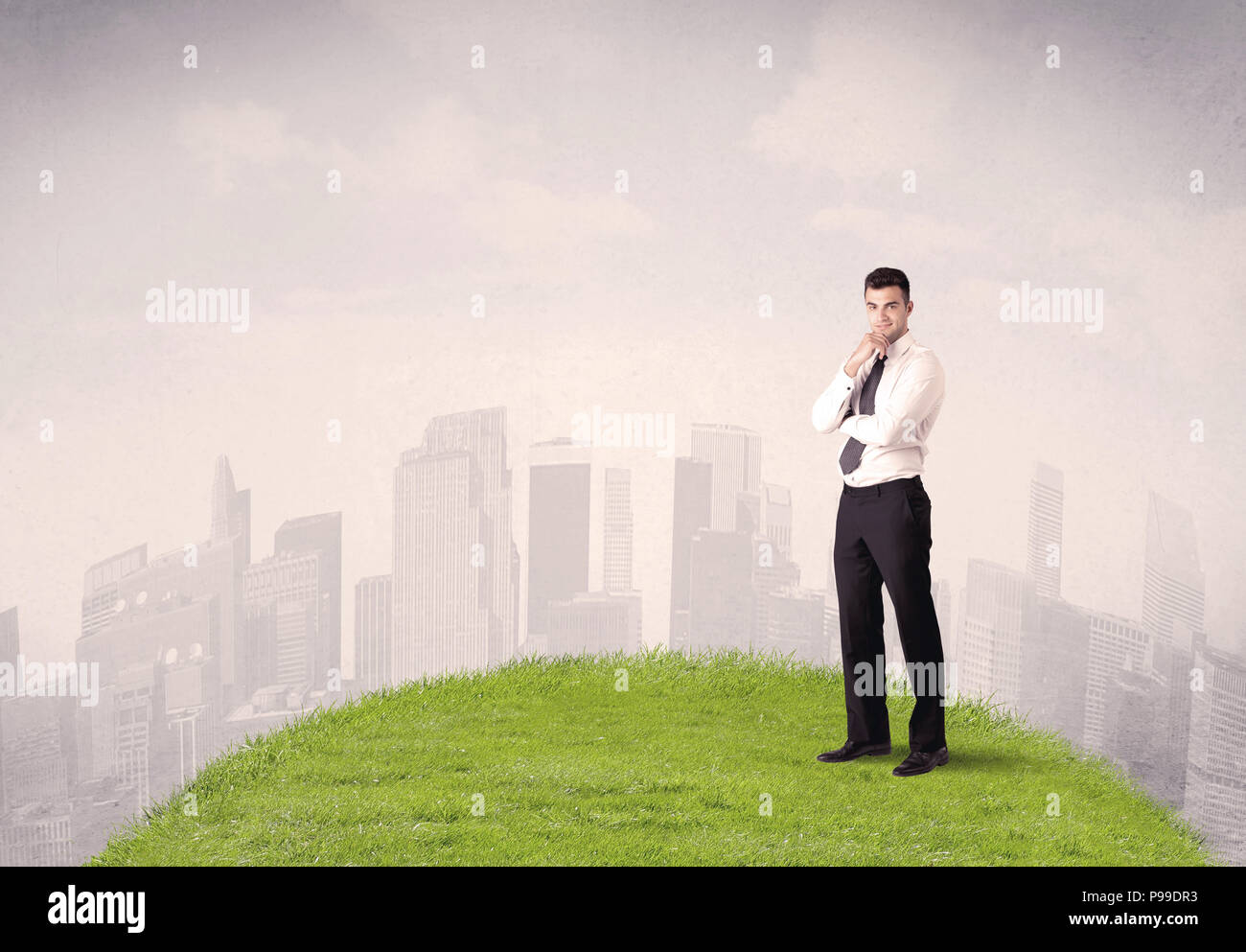 A confident male well looking office manager standing in small green ...