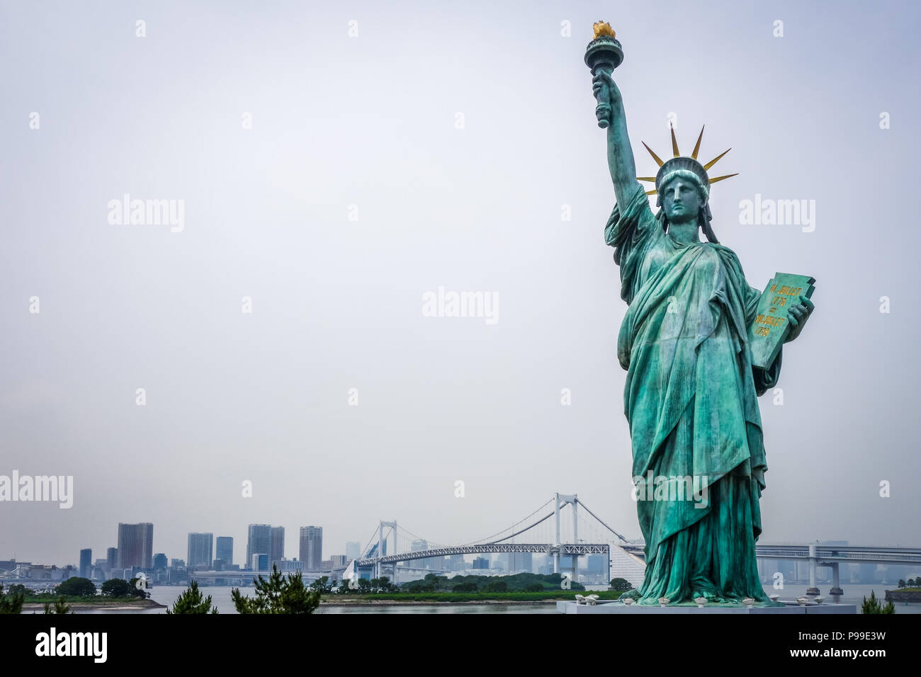 Statue of liberty, rainbow bridge and tokyo cityscape, Japan Stock ...
