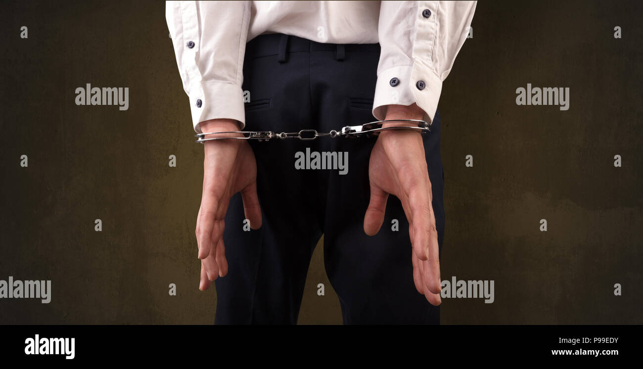 Close now arrested men hand with dark background and handcuffs Stock ...