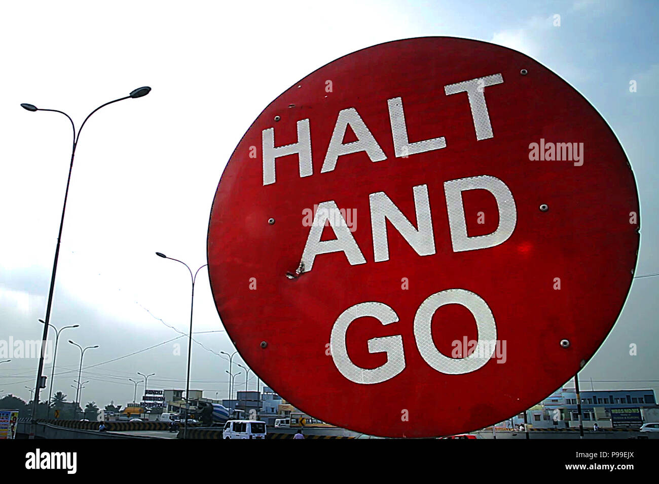 halt and go sing, road sing, day effects Stock Photo - Alamy