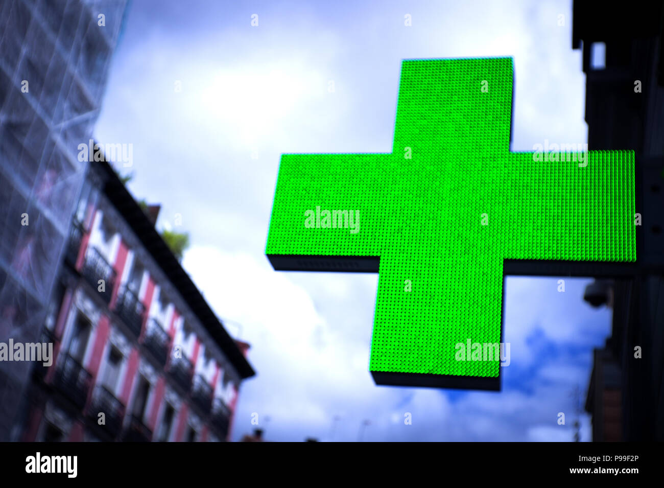 Sign in the shape of a cross indicating the existence of a pharmacy ...