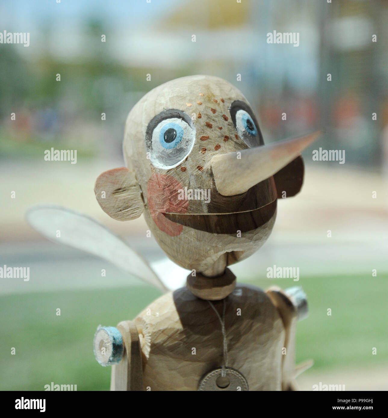 Traditional wooden pinocchio made by hand with fairy wings and a key to ...