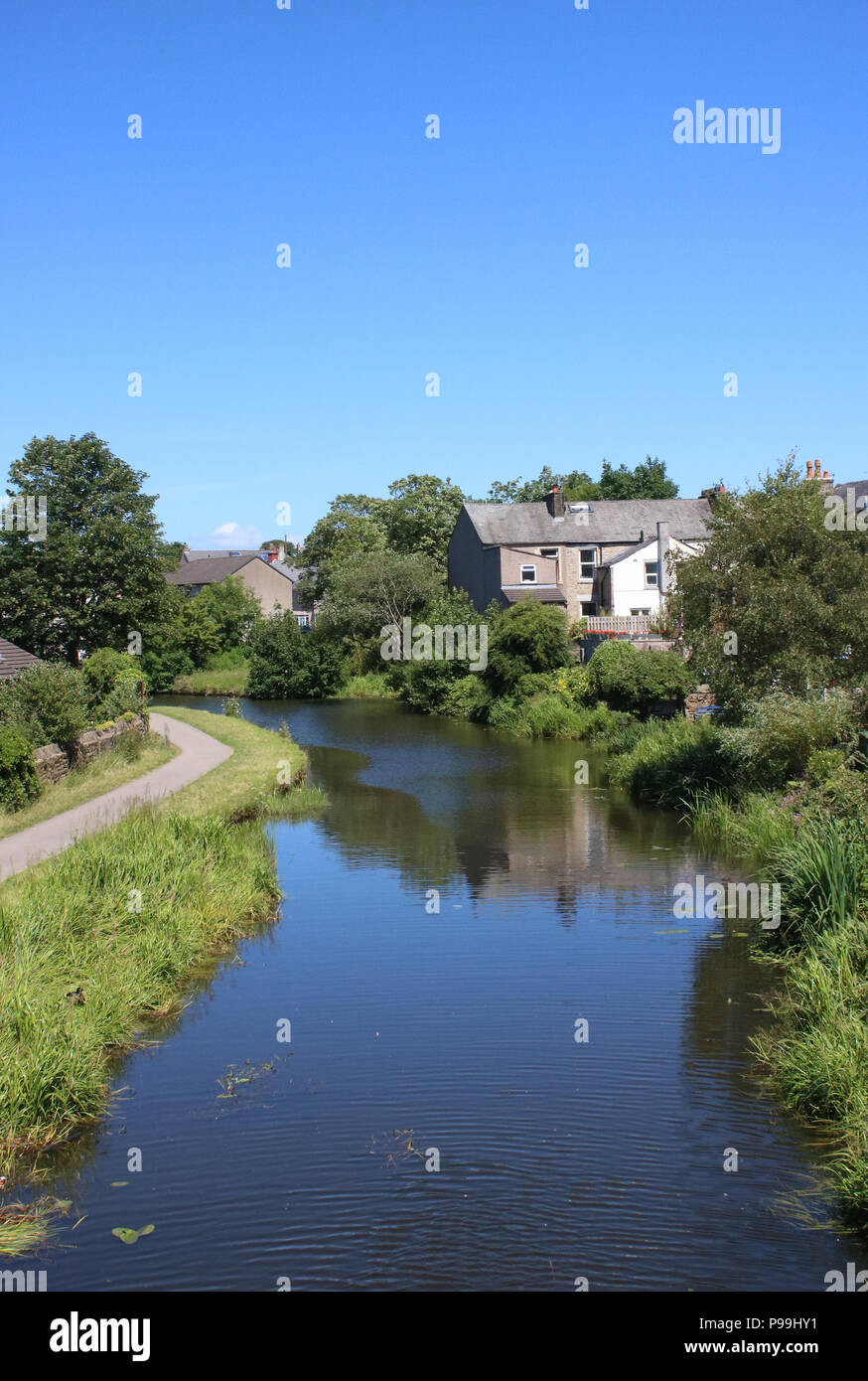 View along the Lancaster canal and towpath from Shaw Street bridge in ...