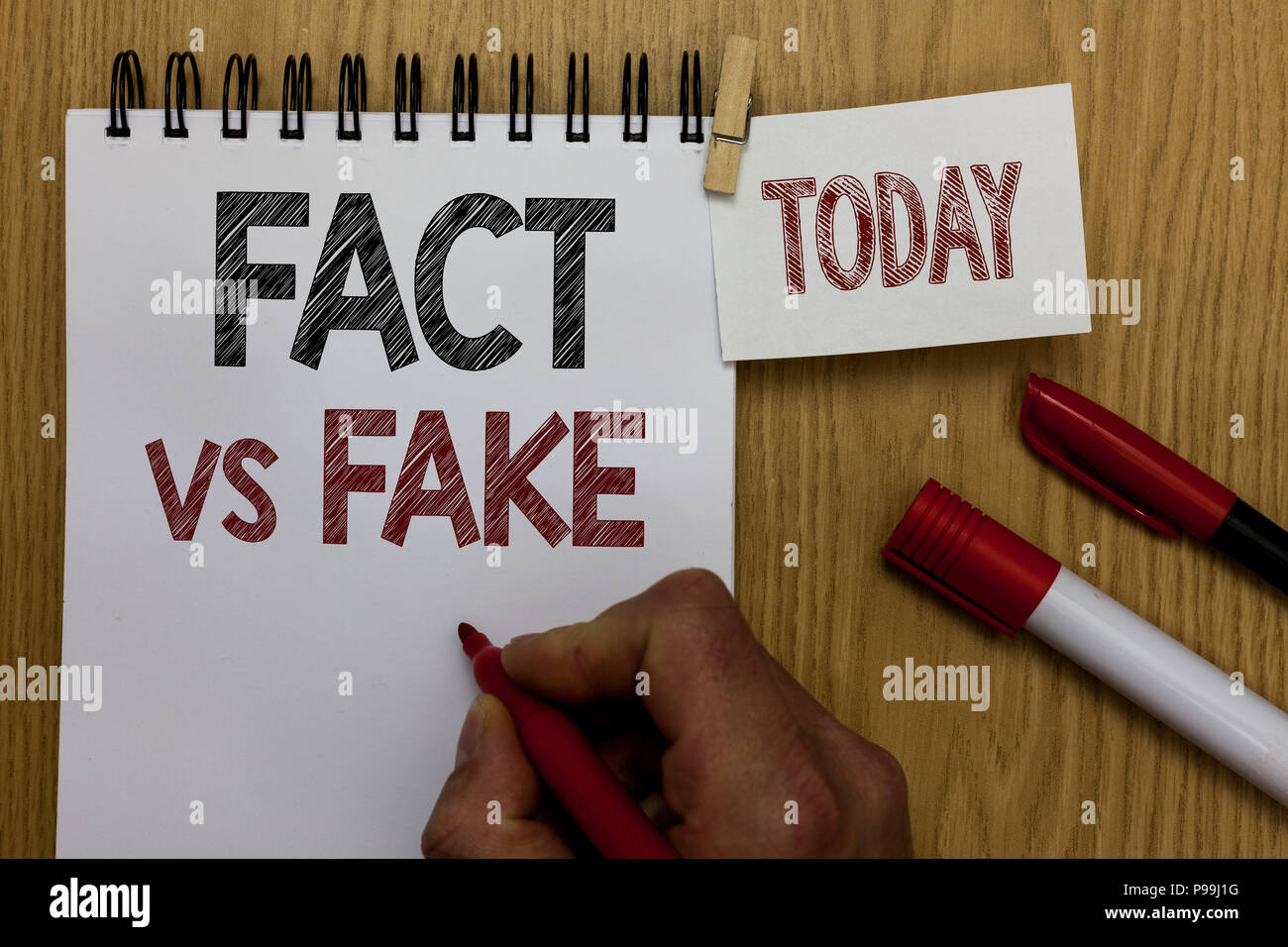Conceptual hand writing showing Fact Vs Fake. Business photo text ...