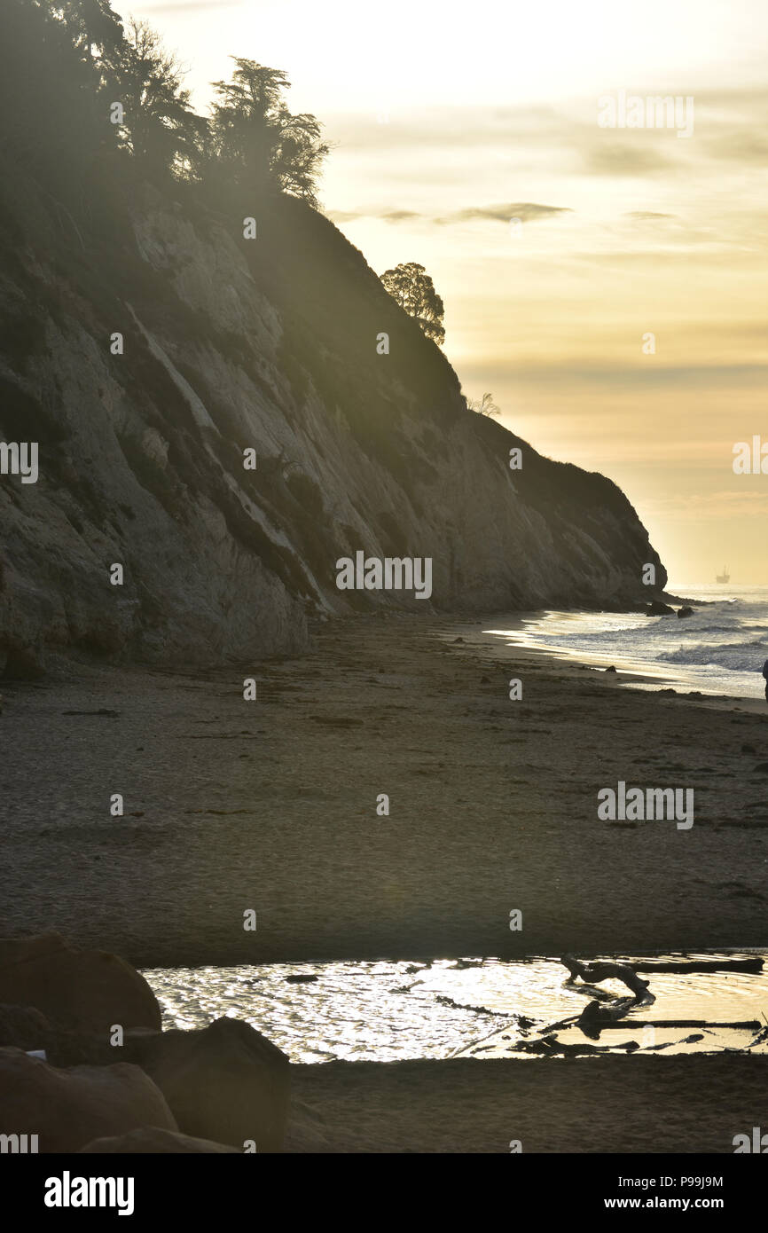 Large cliffs with a sunrise rising Stock Photo - Alamy