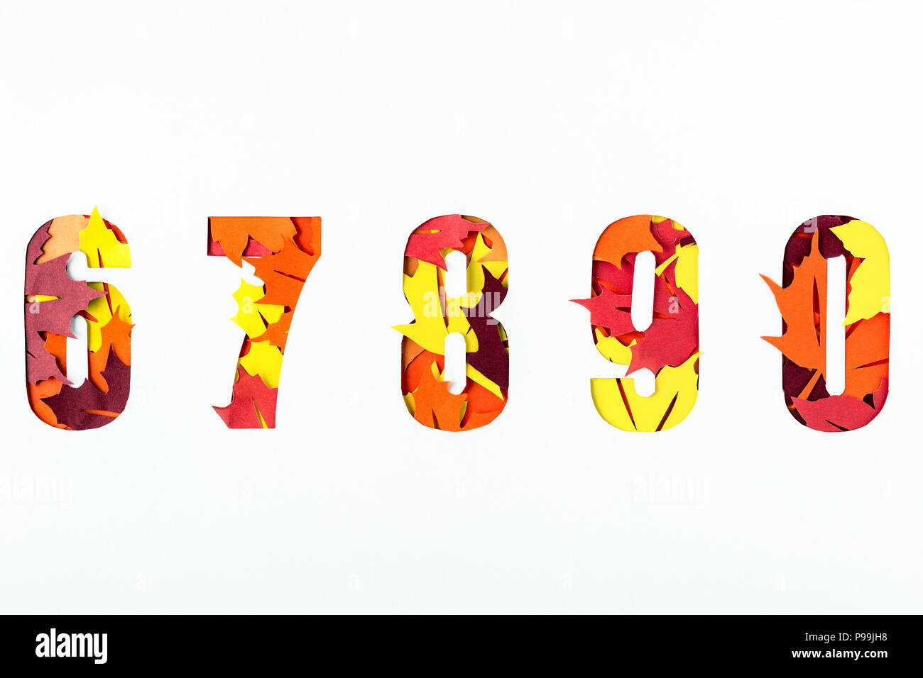 Numbers 6, 7, 8, 9, 0 text with paper cut maple leaves. Top view Stock ...