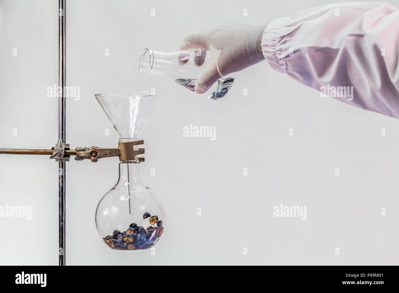 a scientist in Laboratory refining equipment Distillation of Alcohol ...