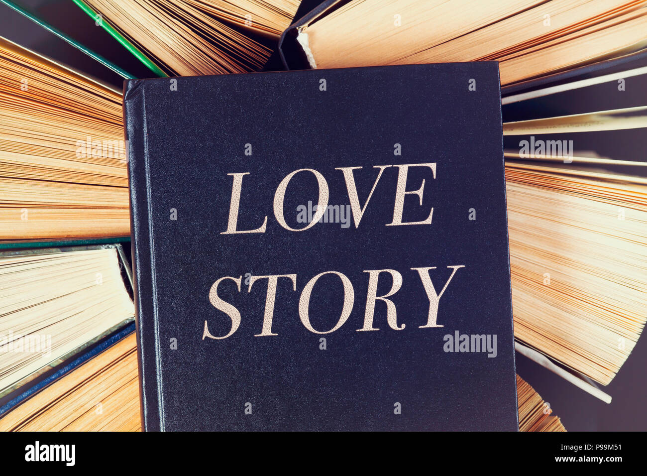 Top view of old hardcover books with book Love Story on top Stock Photo ...