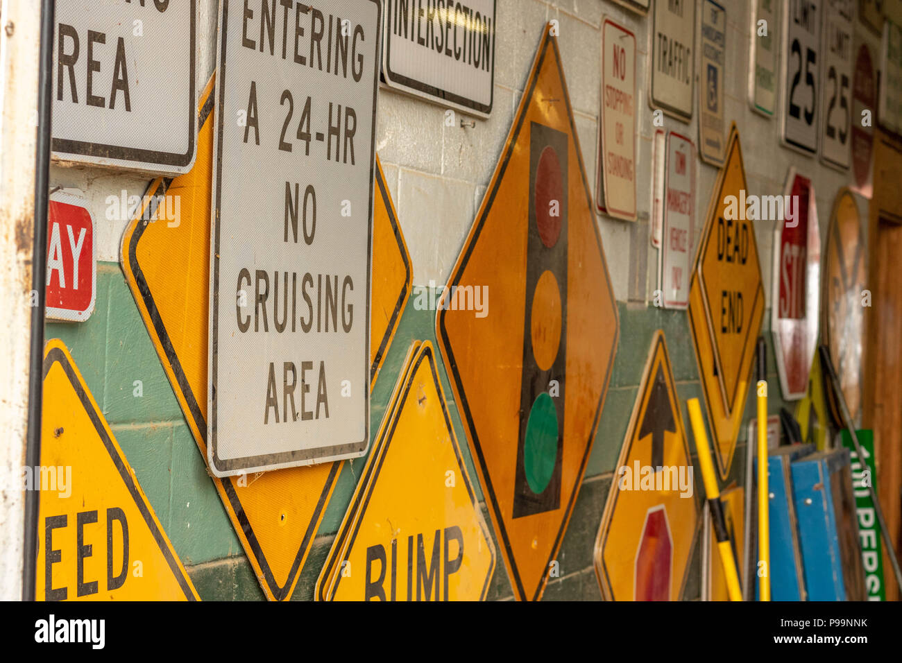 town workers garage with lots of signs Stock Photo - Alamy