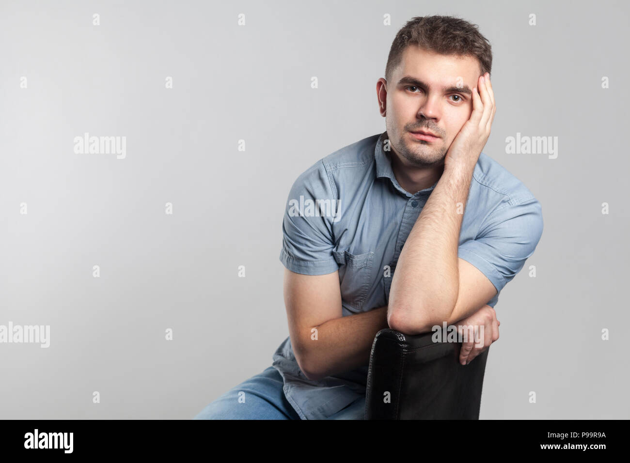 Puzzled serious man sit and thinking. Actors portfolio picture, emotion ...