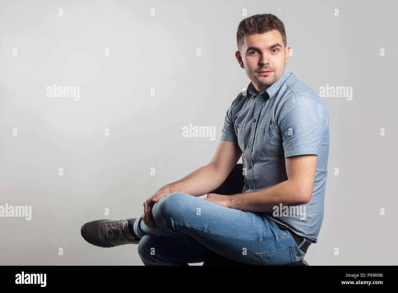 Young adult man little smiling and looking at camera. Actors portfolio ...