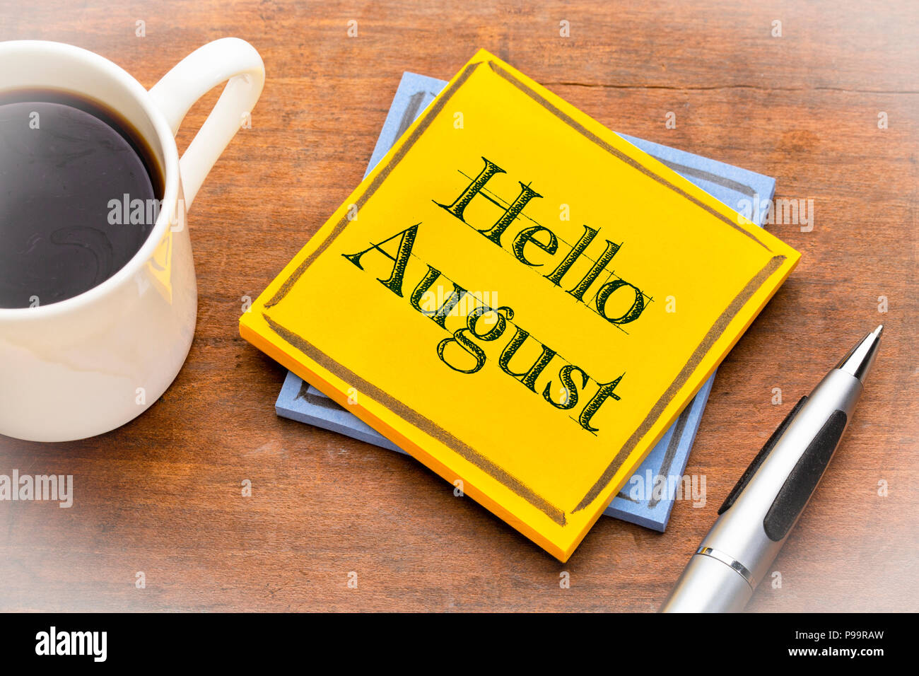 Hello August - text on a sticky note against rustic wood with a cup of ...