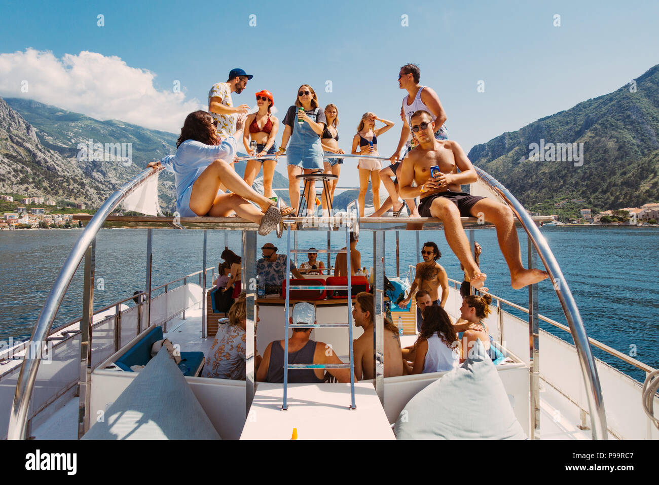 young revellers drinking on a boat in Kotor, Montenegro - an ...
