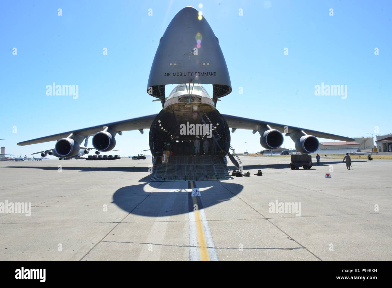A C-5M Super Galaxy sits with its nose open on the flightline July 15 ...