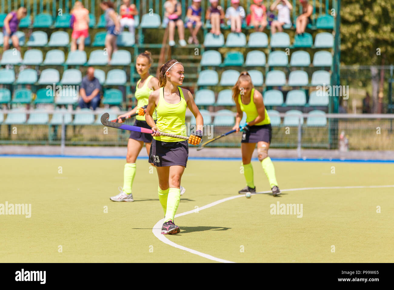 Young hockey player girl with stick in the game Stock Photo - Alamy