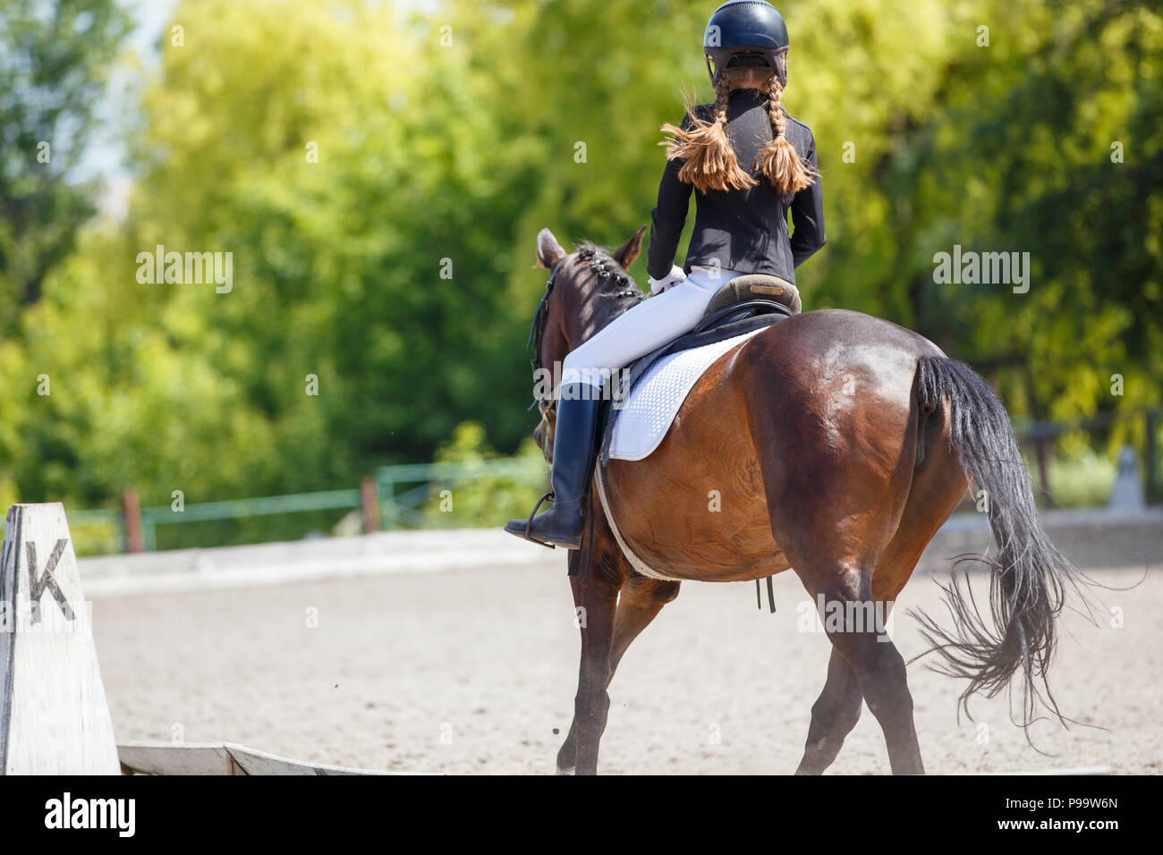 Young girl riding horse on equestrian competition Stock Photo - Alamy