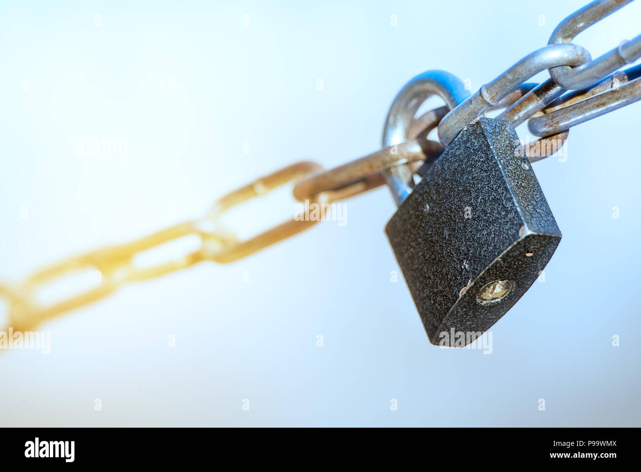 close up metal lock with chain, sunny Stock Photo - Alamy